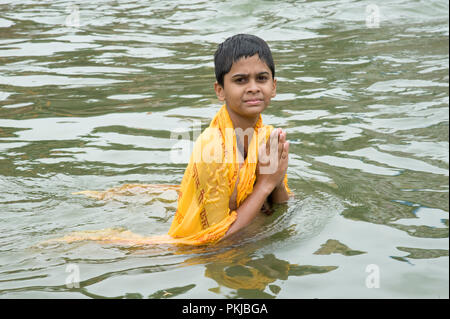 Hindu Child Sadhu praying after a holy dip at Panchavati ram kund in ...