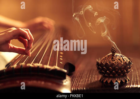 Young woman playing the lyre Stock Photo - Alamy