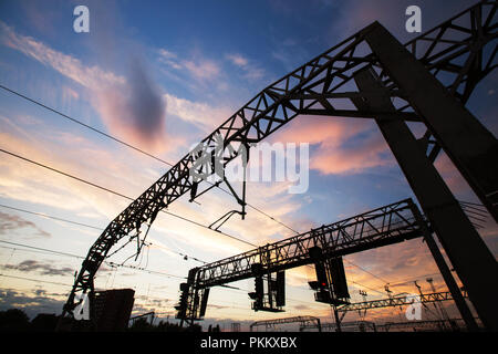 Electric train cables and pylons on Crewe station at sunset, Cheshire ...