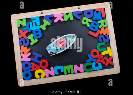 Model boat and Colorful wooden Letters of Alphabet Stock Photo - Alamy