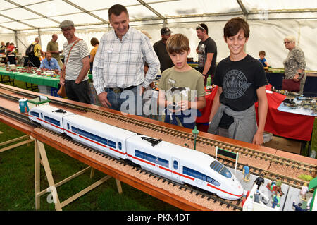Visitors playing with a miniature railway at a railway models weekend ...