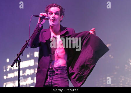 Matthew Healy, lead singer of The 1975, onstage during a major festival ...