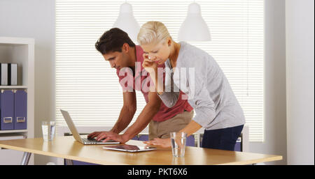 Businessteam working hard in the office Stock Photo - Alamy