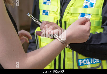 Police officer with handcuffs Stock Photo: 31849482 - Alamy