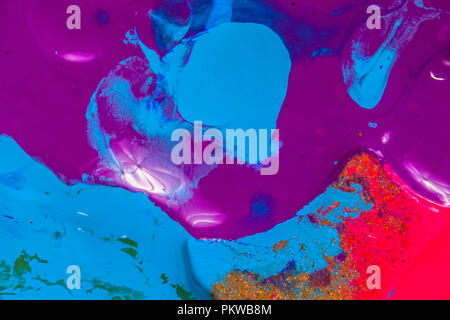 colorful of screen printing ink dropped on the ground made an abstract ...