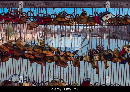 Padlocks on the fence of Paris' famous Pont des Arts in France, where ...