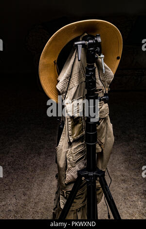 nostalgic hat and photo vest on light stand Stock Photo - Alamy