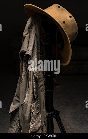 nostalgic hat and photo vest on light stand Stock Photo - Alamy