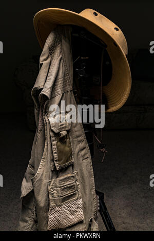 nostalgic hat and photo vest on light stand Stock Photo - Alamy