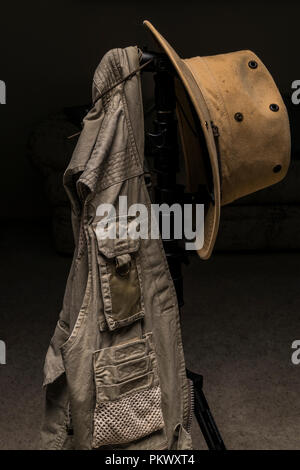 nostalgic hat and photo vest on light stand Stock Photo - Alamy