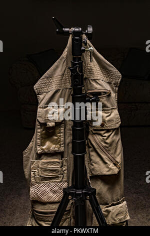 nostalgic hat and photo vest on light stand Stock Photo - Alamy