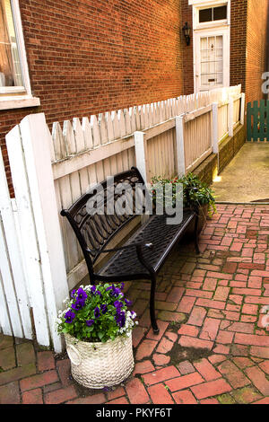 An rustic picket fence and weathered building sit atop a hilltop in ...