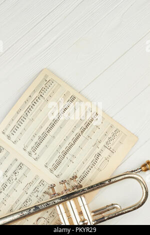 Musical notes, trumpet and copy space. Old trumpet and music pages on ...