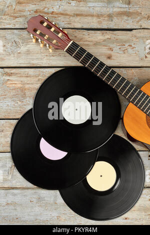Three vinyl plates on wooden background Stock Photo - Alamy