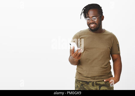 African american plump guy student passing test online Stock Photo - Alamy
