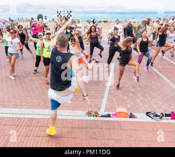 Zumba class overlooking beach in Spain Stock Photo - Alamy