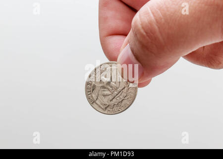 Male hand holding quarter dollar Fort McHenry coin, white background ...