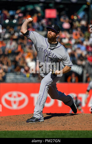 Colorado Rockies relief pitcher Wade Davis jokes with teammates as they ...
