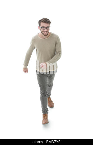 modern young man confidently goes forward. Photo in full length Stock ...