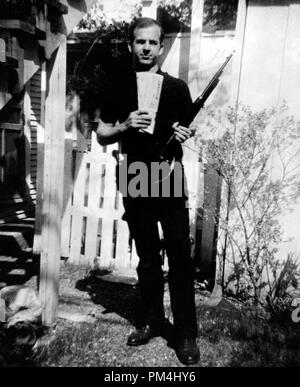 Photo of Lee Harvey Oswald with rifle, taken in Oswald's back yard ...