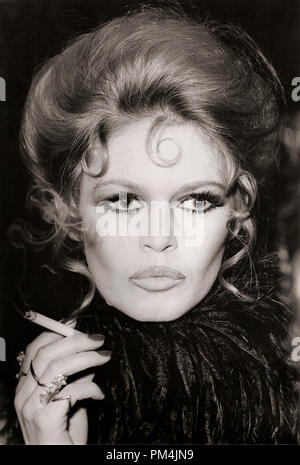 Brigitte Bardot smoking a cigarette, circa 1963 File Reference # 33371 ...