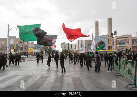 Young men waving flags during a public procession in the lead up to ...