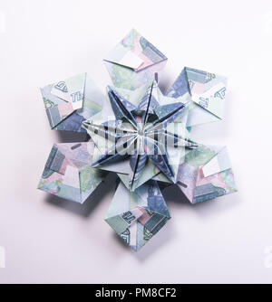 Money Origami snowflake Stock Photo - Alamy