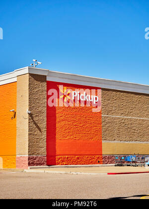 Walmart pickup sign and corporate logo on exterior wall of a super ...