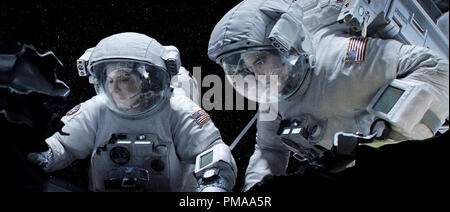 SANDRA BULLOCK as Ryan Stone and GEORGE CLOONEY as Matt Kowalski in ...