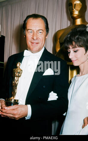 Audrey Hepburn and Rex Harrison at the 37th Annual Academy Awards, 1965 ...