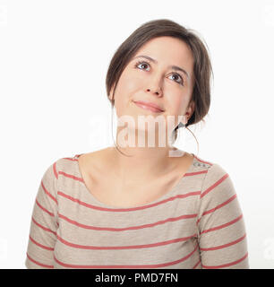 Portrait of young woman looking upwards on a white background Stock ...