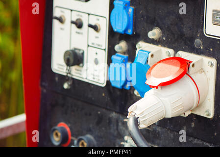 Electric power aggregate generator in industrial hemp field Stock Photo ...