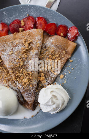 Overhead view of pancakes with strawberries and strawberry syrup Stock ...
