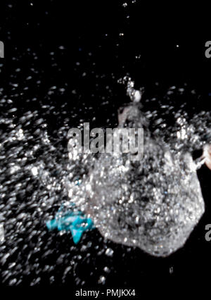 Exploding blue balloon with water inside, motion sequence Stock Photo ...