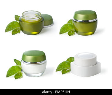 Jars of cream with branch of fern isolated on white Stock Photo - Alamy