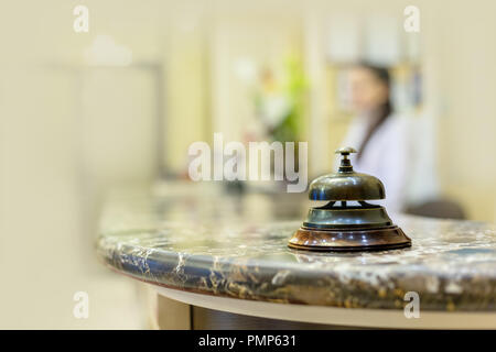 Modern luxury hotel reception counter desk with bell Stock Photo - Alamy