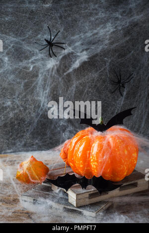 Pumpkin with bats and spiders for Halloween, selective focus. Copy ...