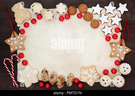 Decorated Christmas gift with candy canes on green background, top view ...