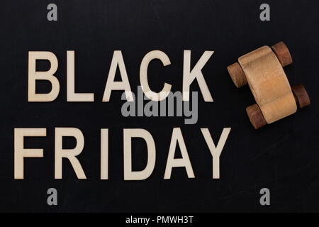 black Friday - text in wooden letters on blackBoard. Copy space Stock ...