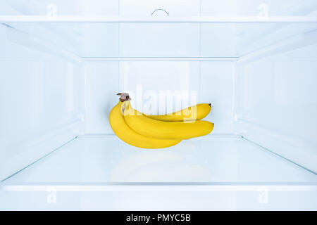 ripe appetizing bananas on shelf in fridge Stock Photo - Alamy