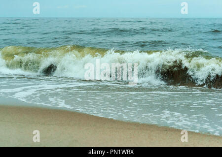 ice sludge in the sea, oil platform in the winter sea on the horizon ...