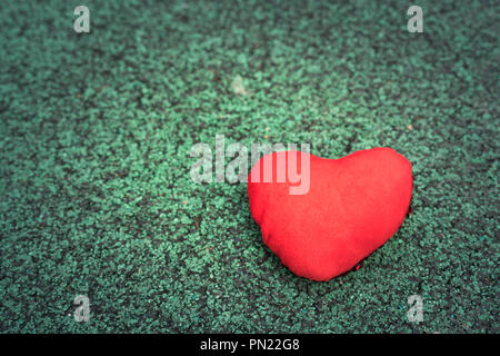 red heart on the green walking path backgrounds with copy space Stock ...