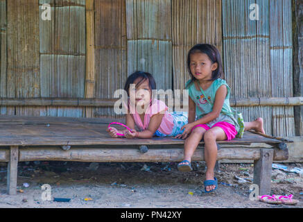 Poor children from Lao village collecting aluminium drink cans at a ...