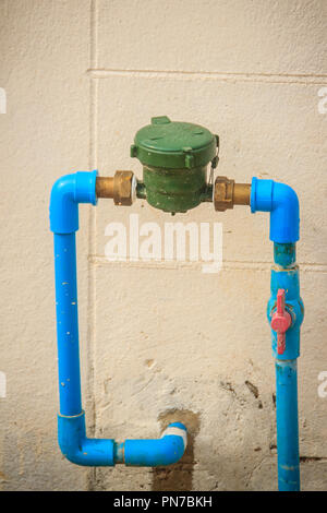 Vintage water meter installed with bronze joint, PVC elbow connector ...