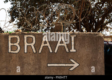 A sign points towards a braai in Zimbabwe. A braai is a southern ...