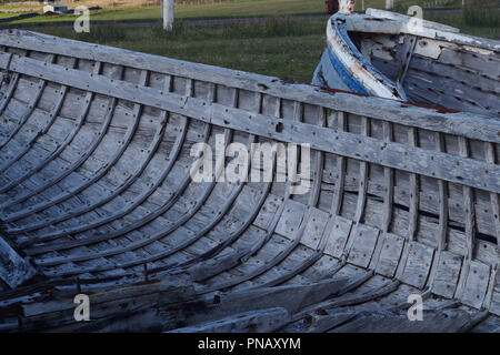 A close up view of the inside of the hull of an old wooden boat showing ...