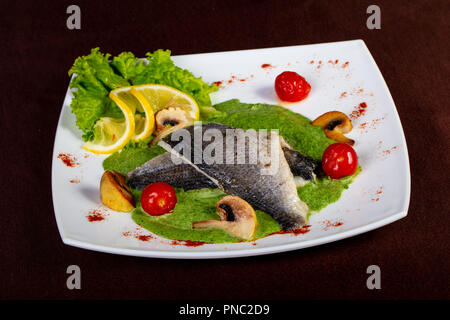 Steamed Dorada fish fillet with sauce Stock Photo - Alamy