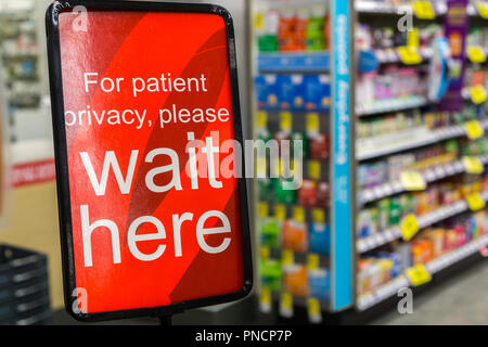 Please Wait to be Seated sign Stock Photo - Alamy