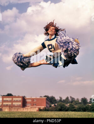 Cheerleader jumping, mid-air, low angle view, (low angle view Stock ...