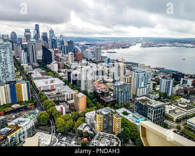 Aerial view of Puget Sound at Seattle lit up by sun rays, with Olympic ...